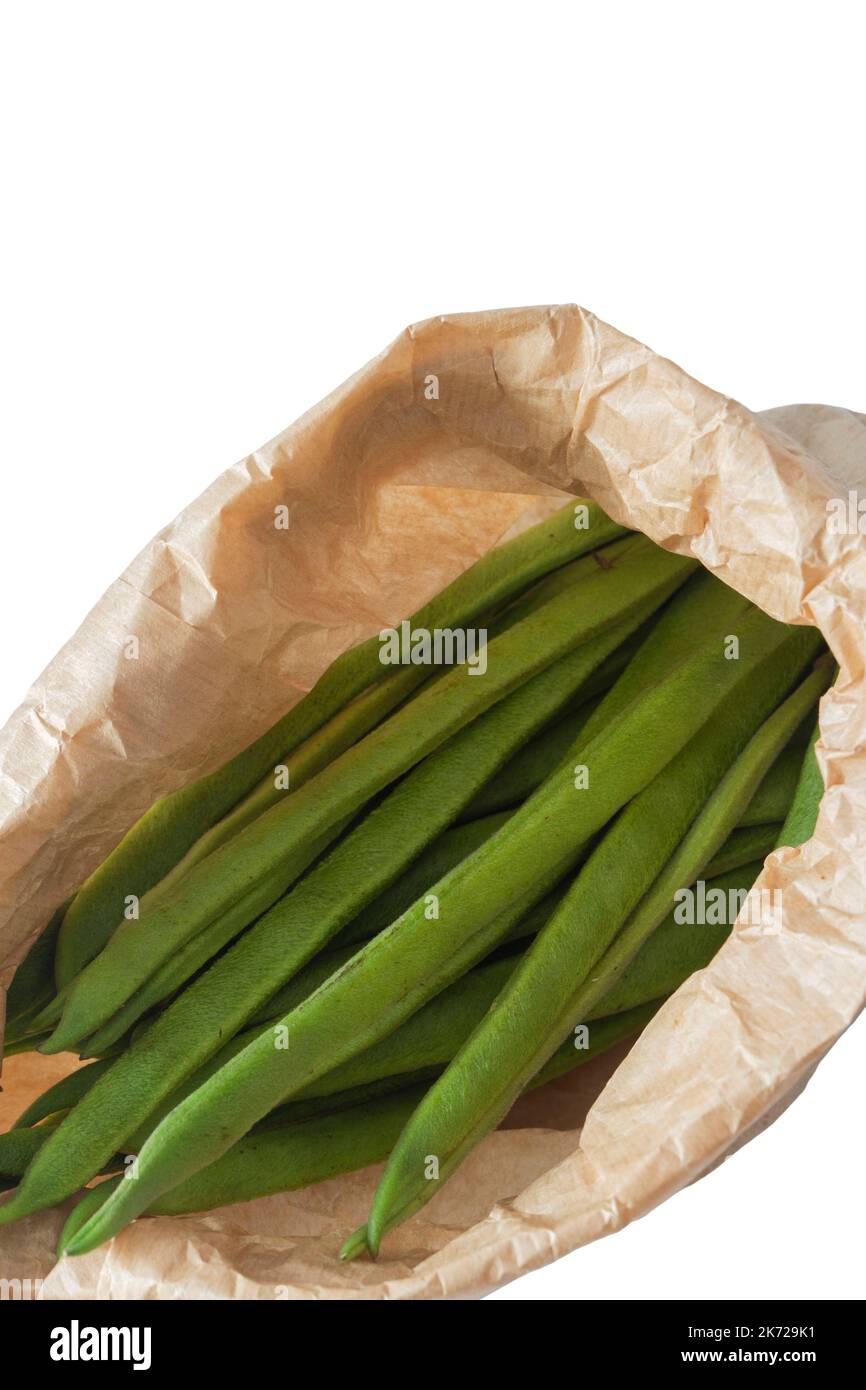 Raw green beans in a brown paper bag. Eco friendly recycling packaging ...