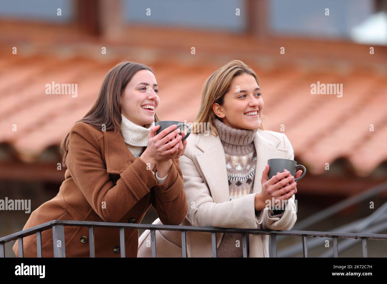 Two people balcony talking hi-res stock photography and images - Alamy