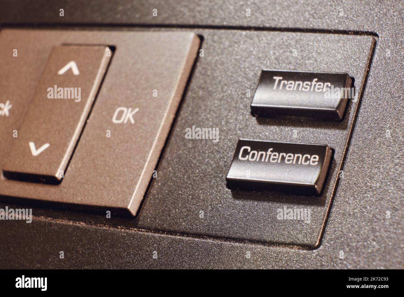 A button with the text transfer and conference on a landline phone in ...