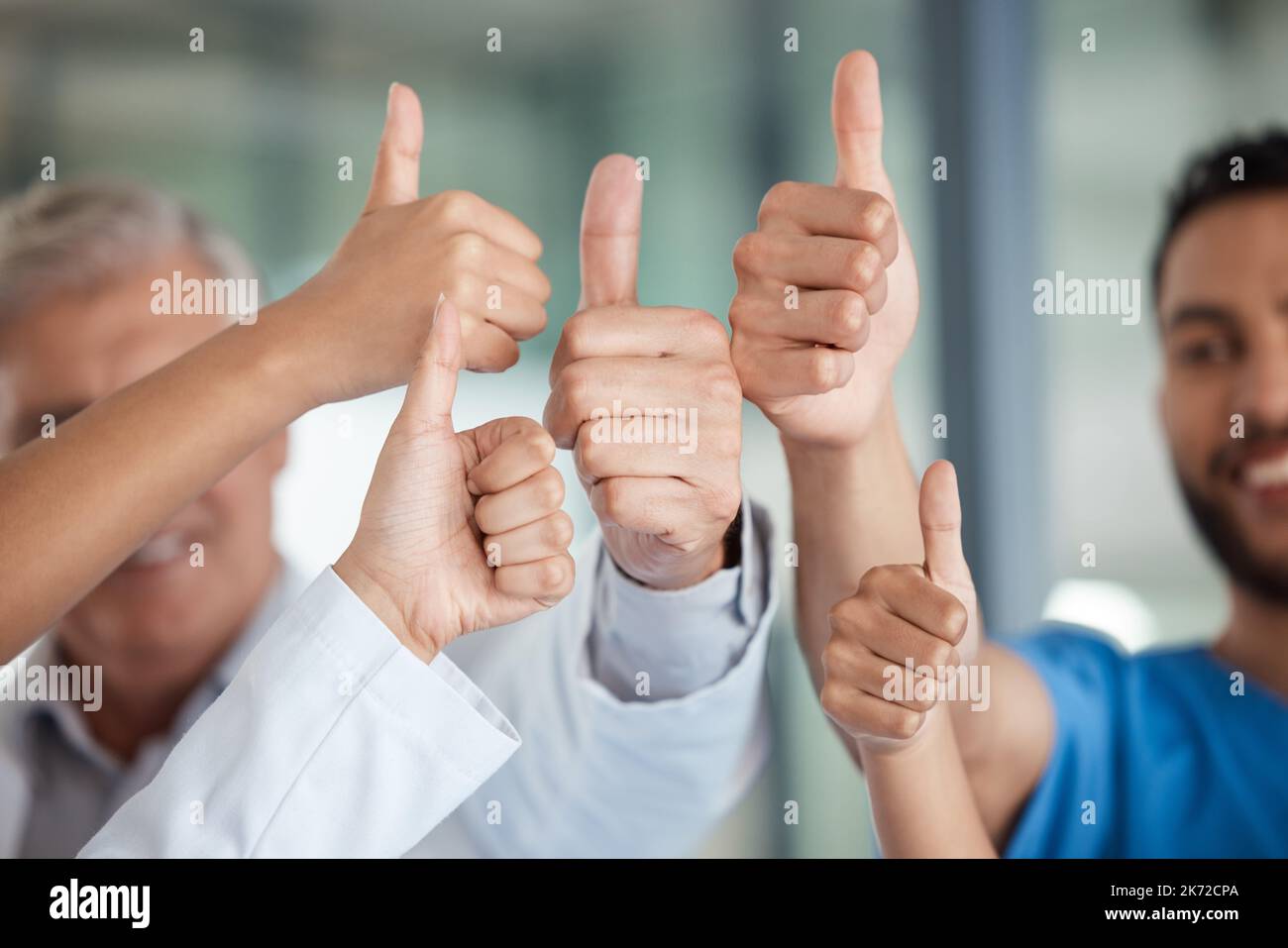 Giving life the thumbs up. medical staff giving the thumbs up Stock ...
