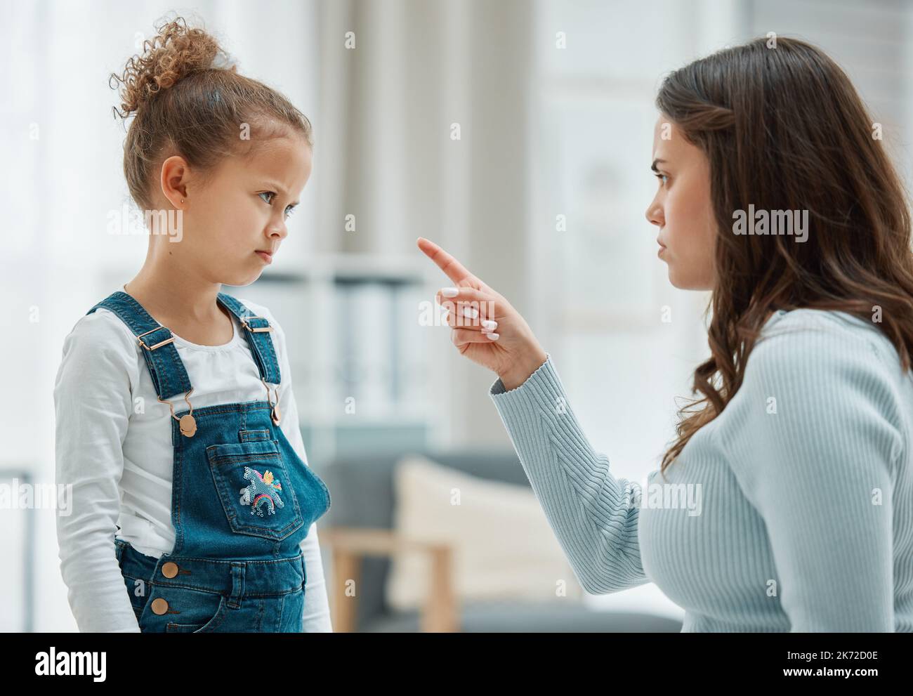 Youve been naughty and this is your punishment. a young mother scolding her daughter Stock Photo ...