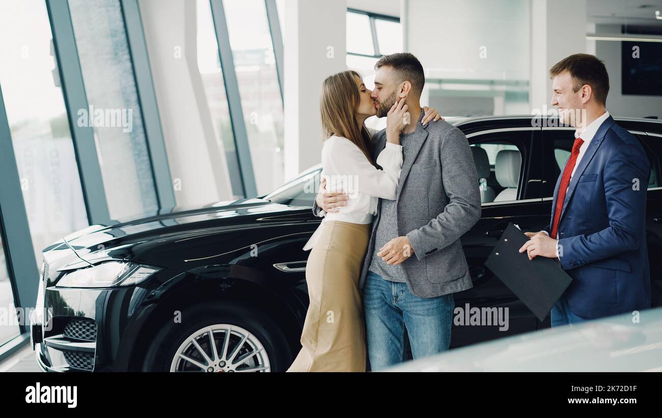 Car dealer giving handshake young hi-res stock photography and images ...