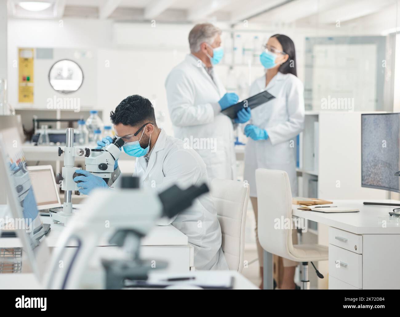 Making scientific advances on the daily. a young scientist using a ...