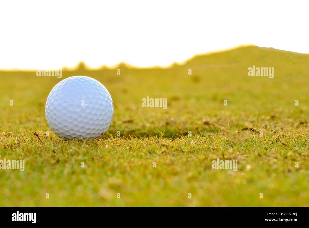 golf course background Golf balls on artificial grass with blur ...