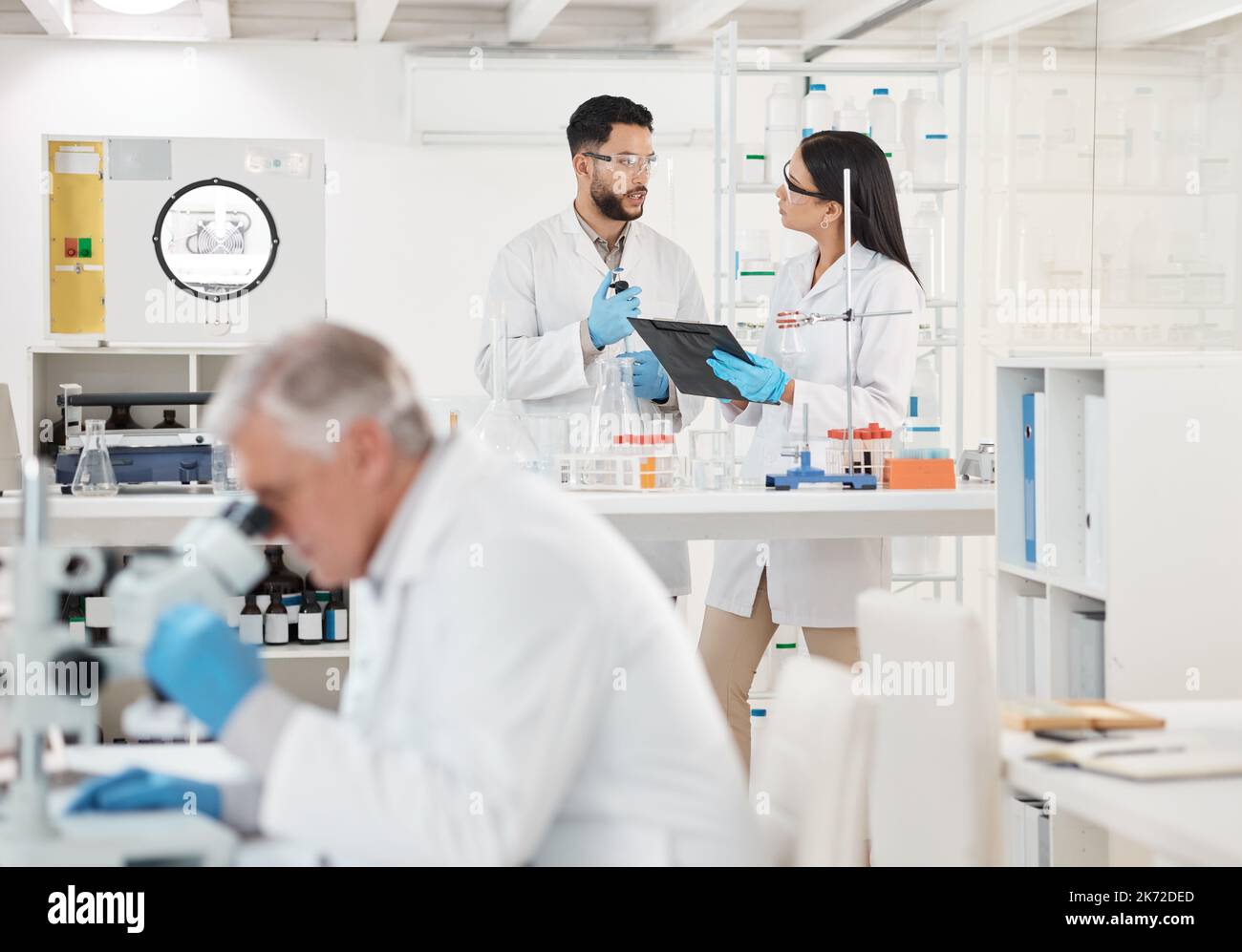 The days discoveries are always interesting. two scientists working together in a lab Stock ...