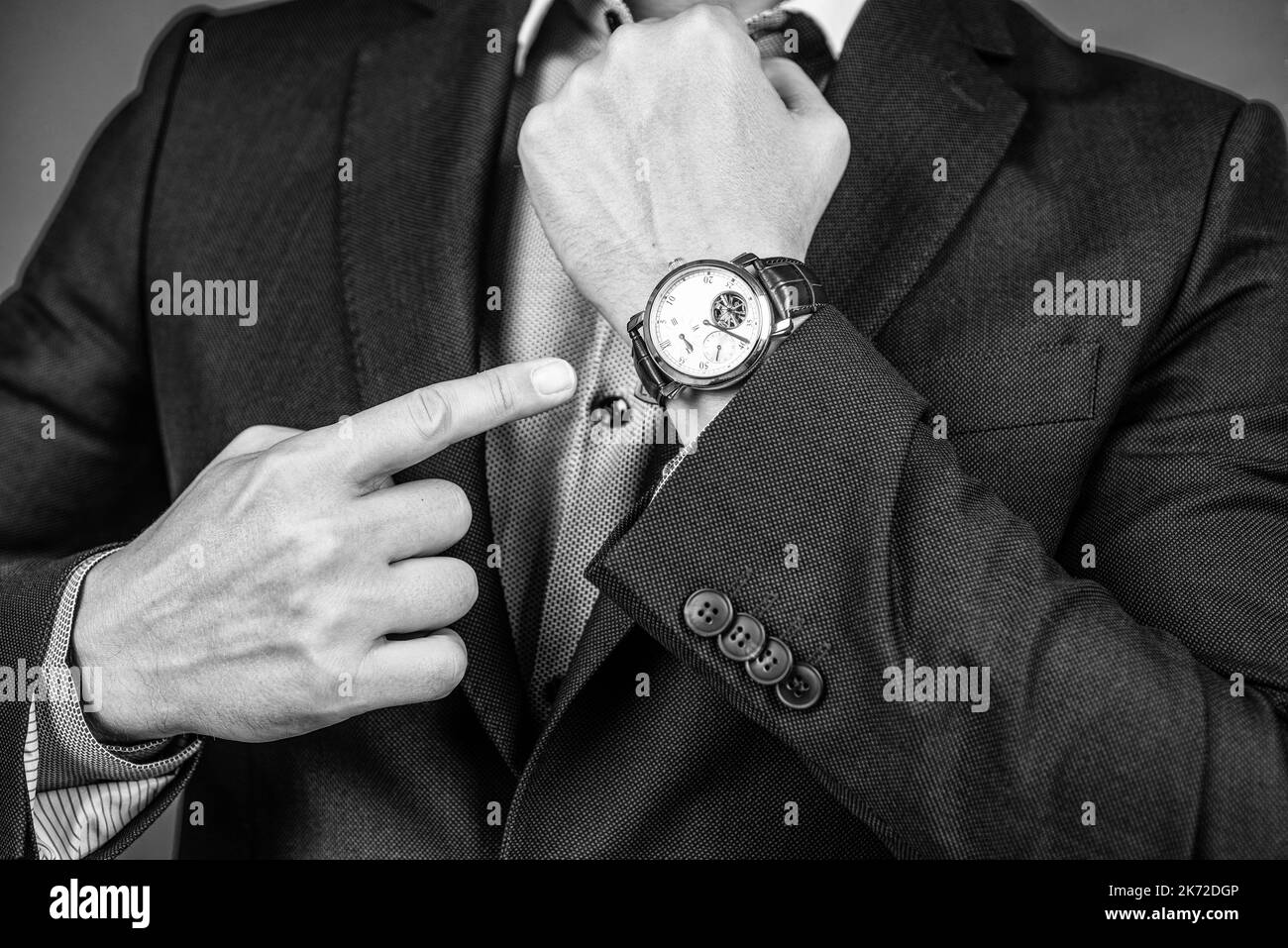 Wearing watch with outfit. Blue suit and wristwatch on male hand ...