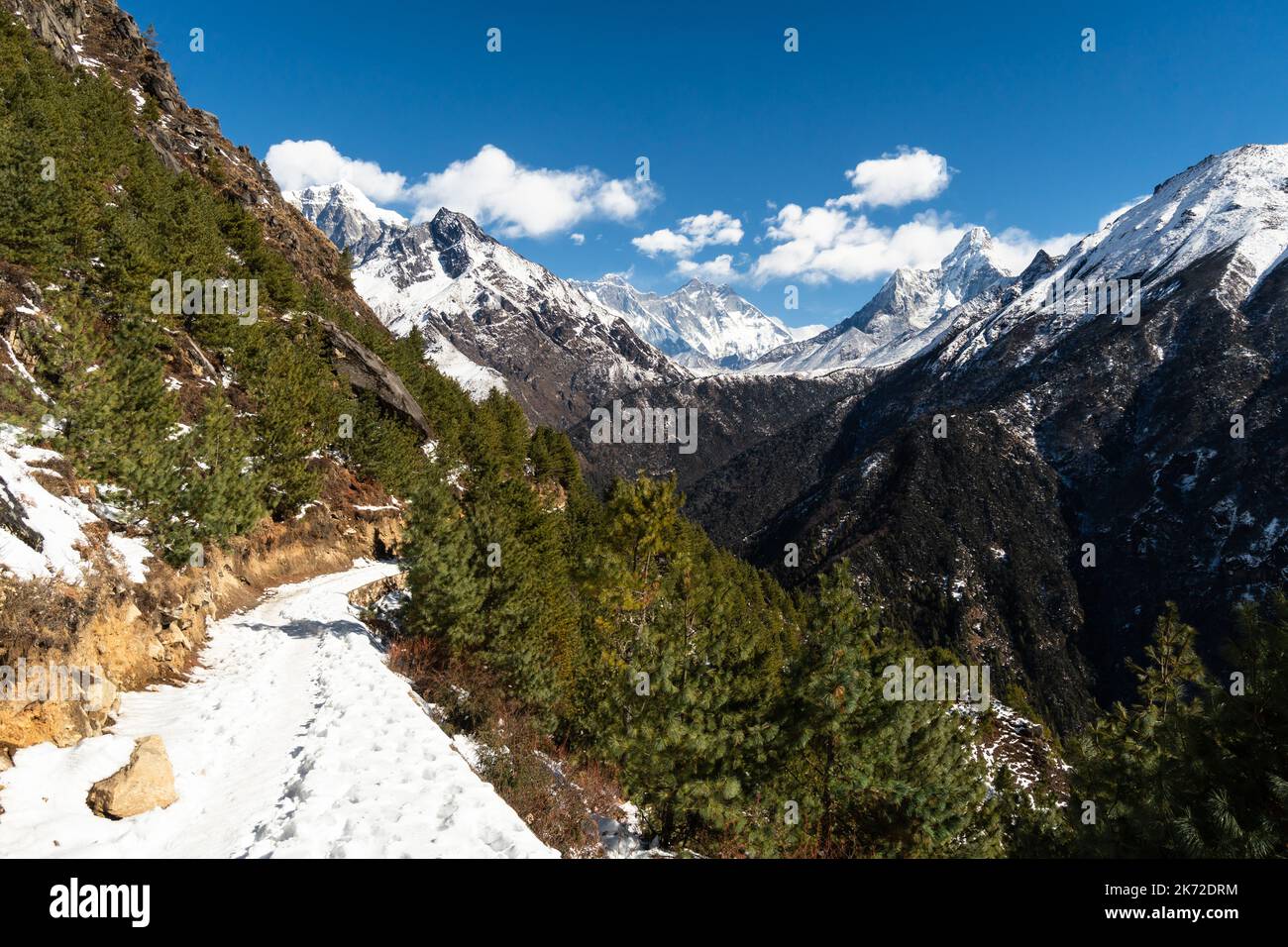 Everest base camp hiking trail after a snowfall in winter with Mt ...
