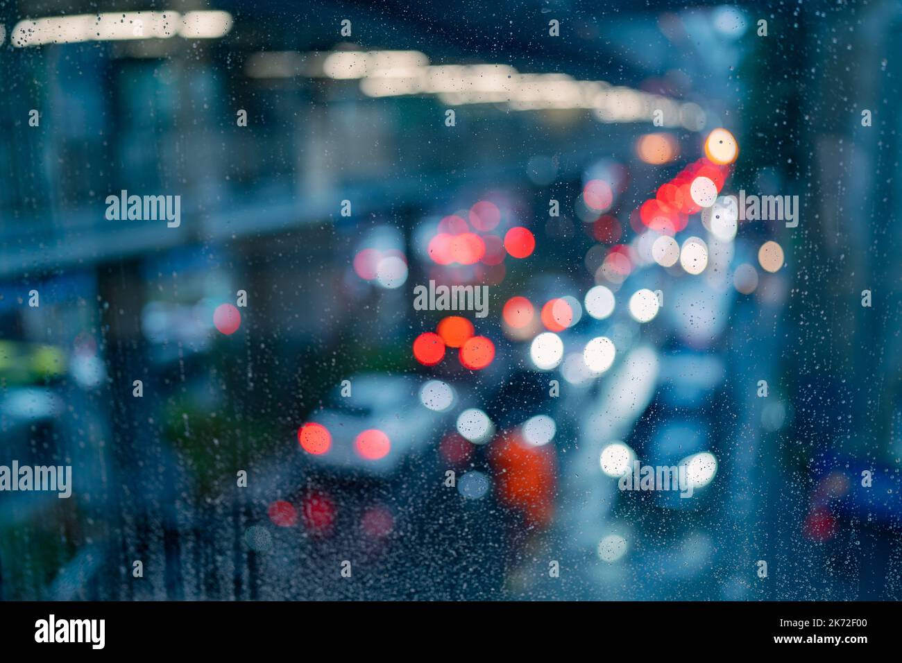 Rain on window with traffic jam view Stock Photo - Alamy