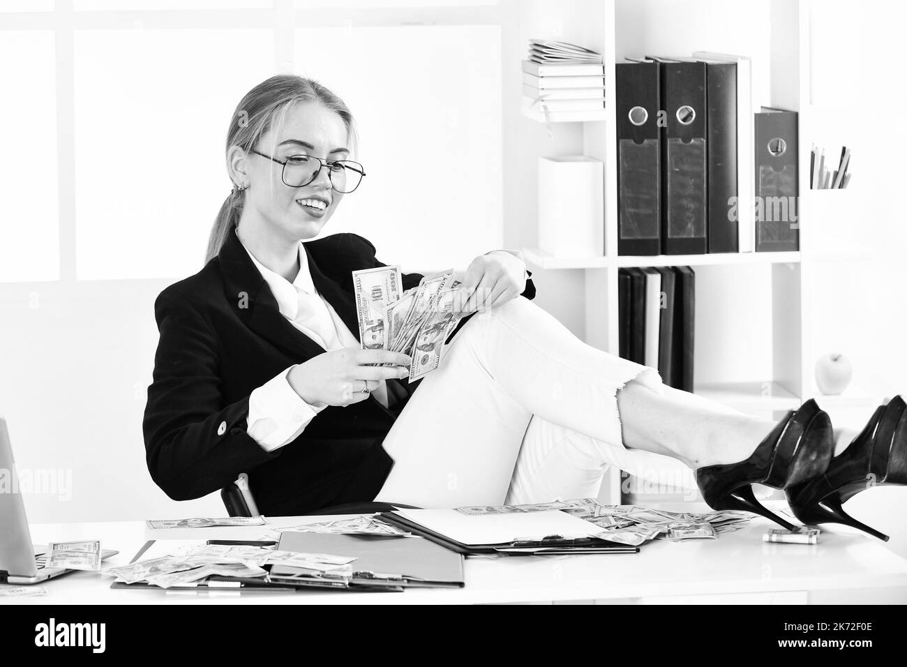 Young woman counting money service Black and White Stock Photos ...