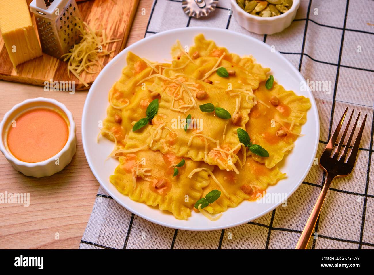 Homemade Pumpkin Ravioli with ricotta cheese served basil Stock Photo ...
