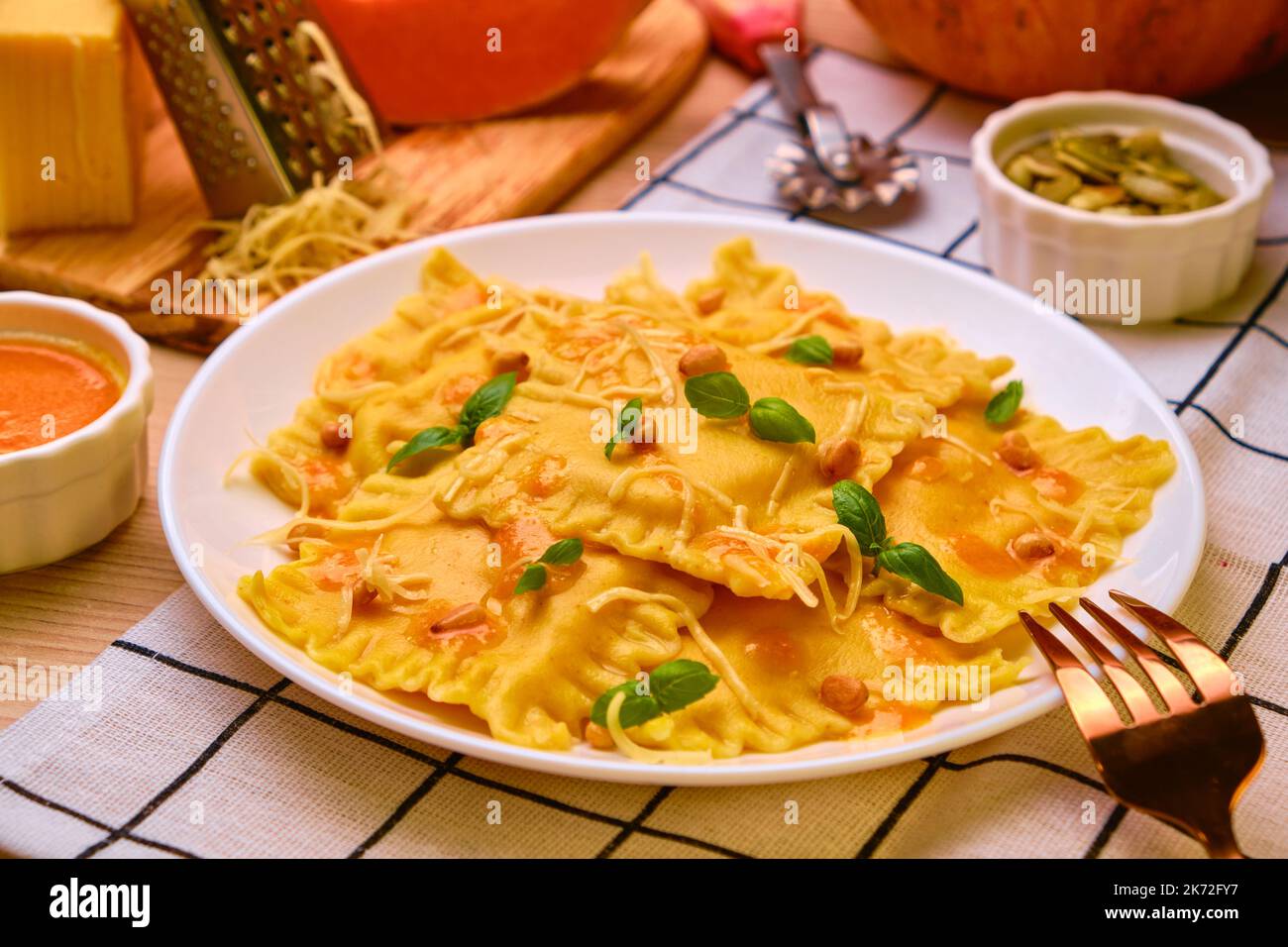 Homemade Pumpkin Ravioli with ricotta cheese served basil Stock Photo ...
