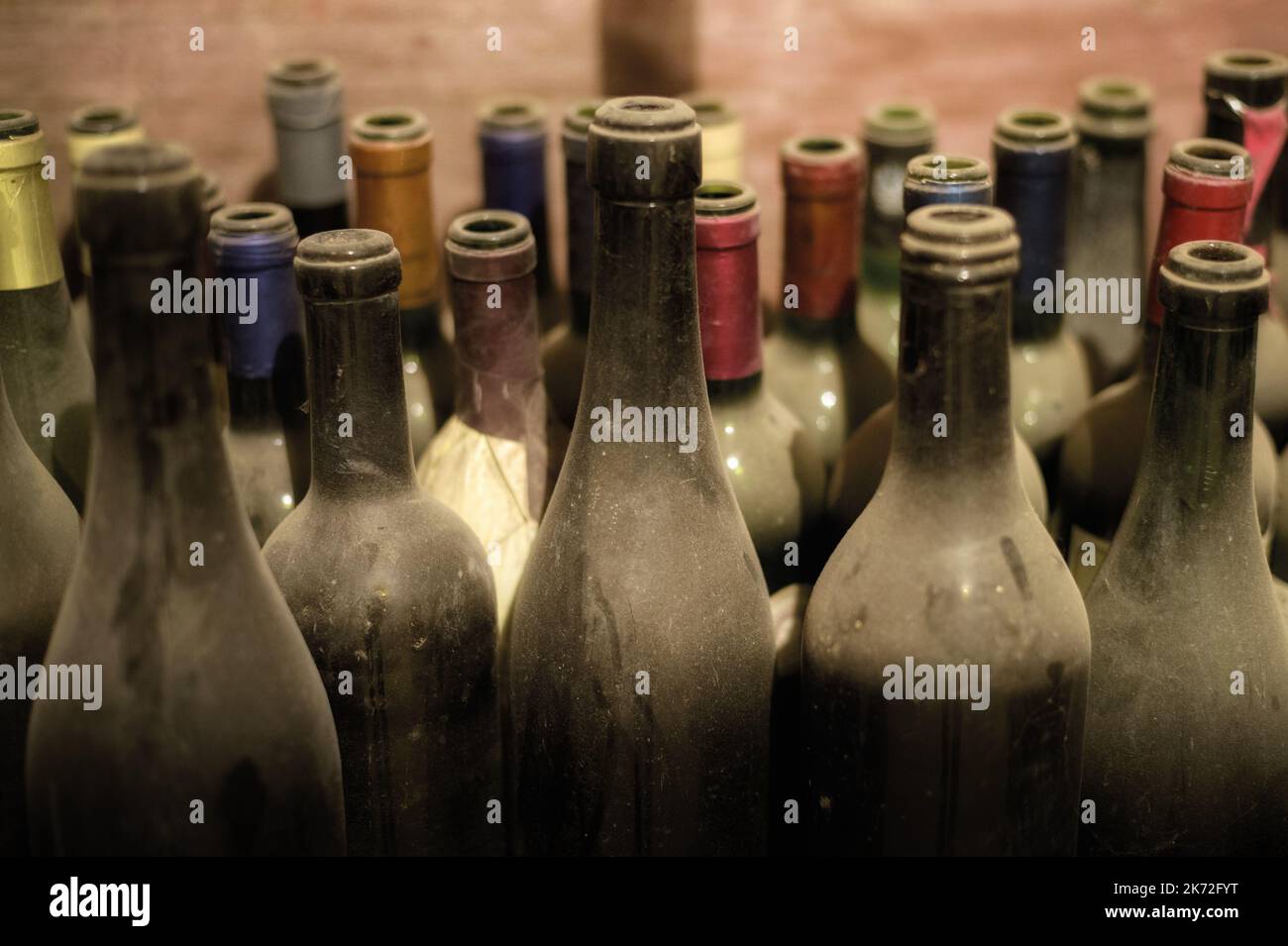 Ancient underground wine cellar with old dusty open wine bottles Stock ...