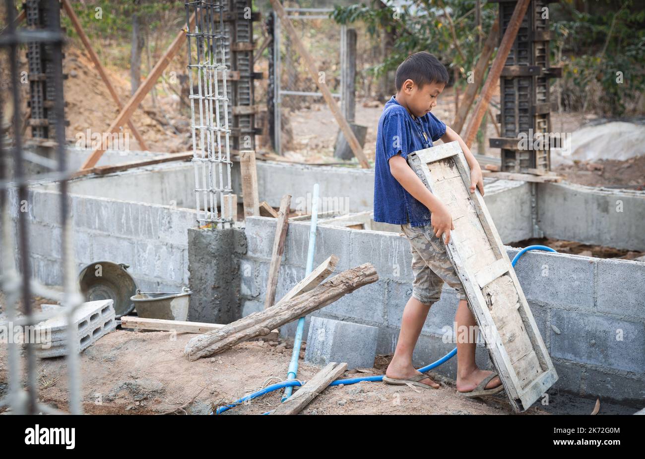 Poor children working at construction site against children labour ...