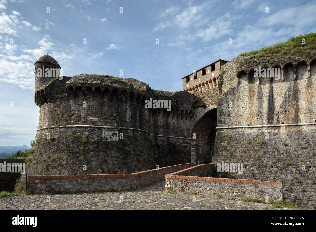 Towers and walls with bridge and moat of the medieval fortress of ...