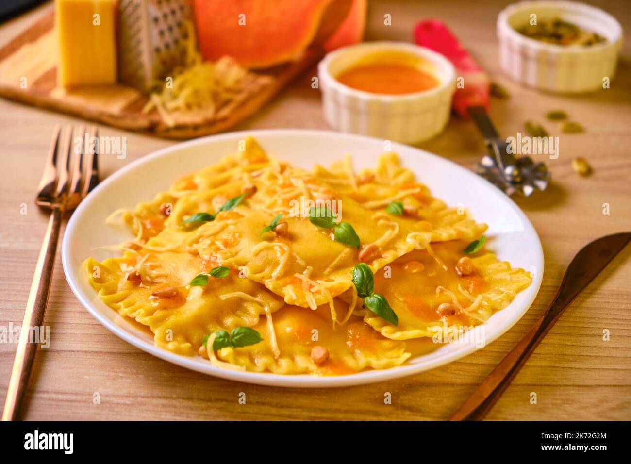 Homemade Pumpkin Ravioli with ricotta cheese served basil Stock Photo ...