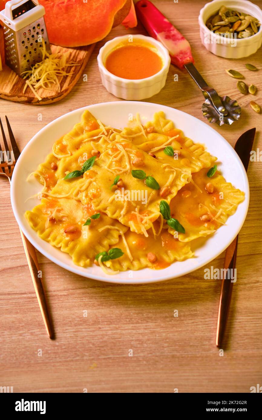 Homemade Pumpkin Ravioli with ricotta cheese served basil Stock Photo ...