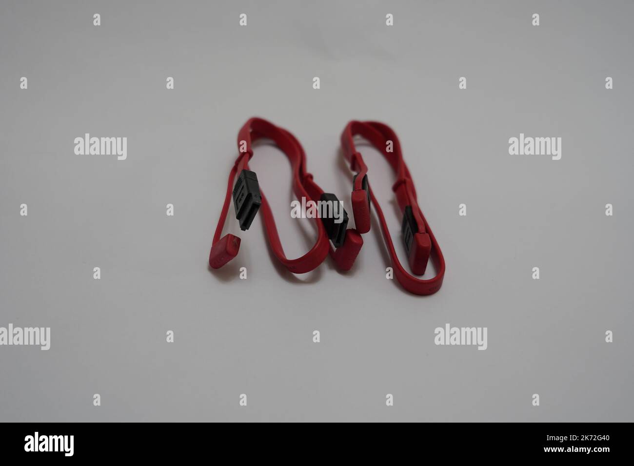 Red Earbuds with Microphone on Light Surface in Close-Up View Stock ...