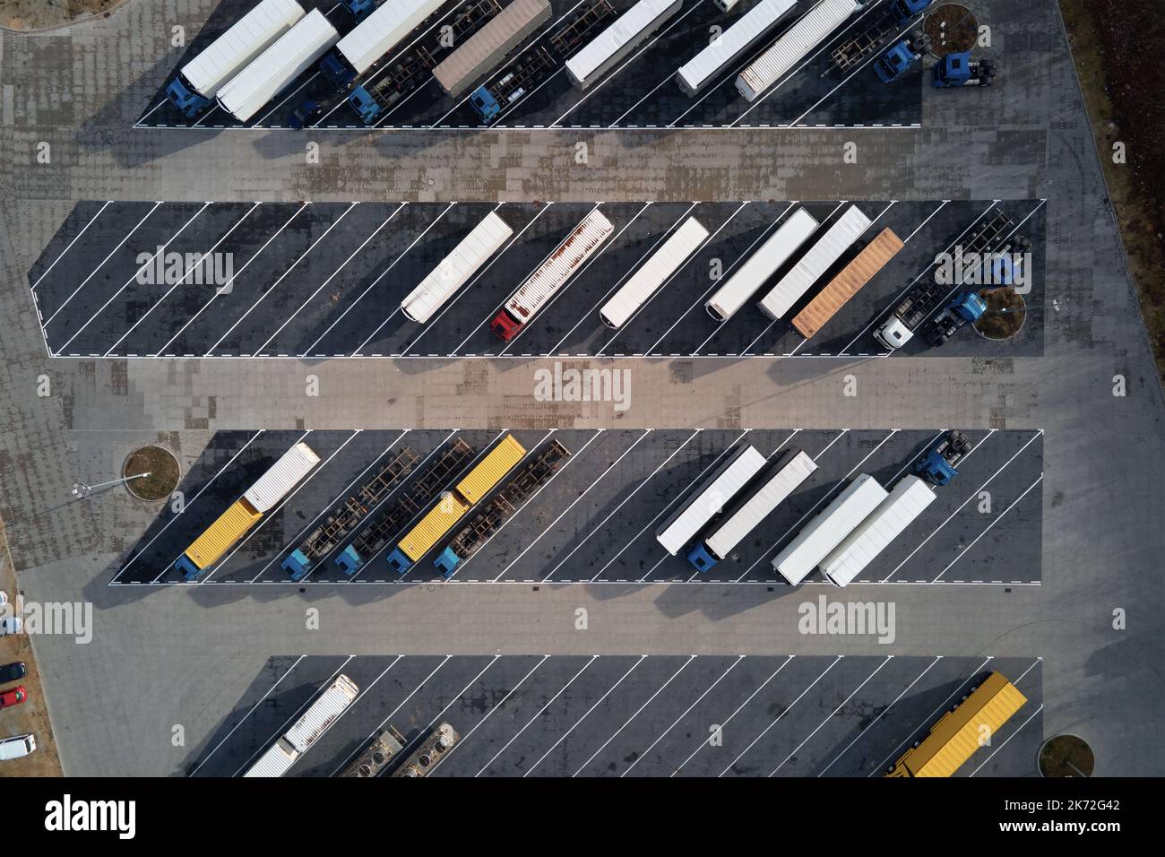 Top view of semi trucks waiting for loading at parking lot at logistic ...