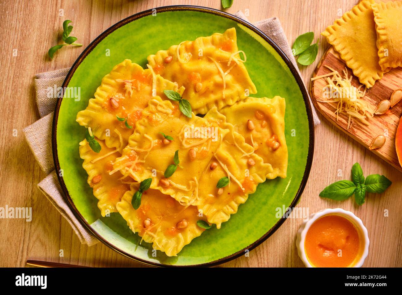Homemade Pumpkin Ravioli with ricotta cheese served basil Stock Photo ...