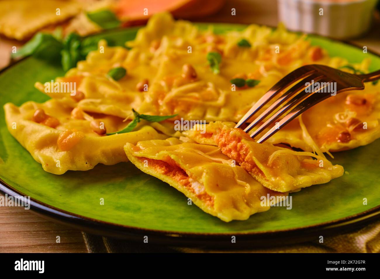 Homemade Pumpkin Ravioli with ricotta cheese served basil Stock Photo ...