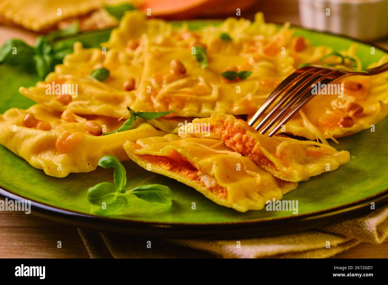 Homemade Pumpkin Ravioli with ricotta cheese served basil Stock Photo ...