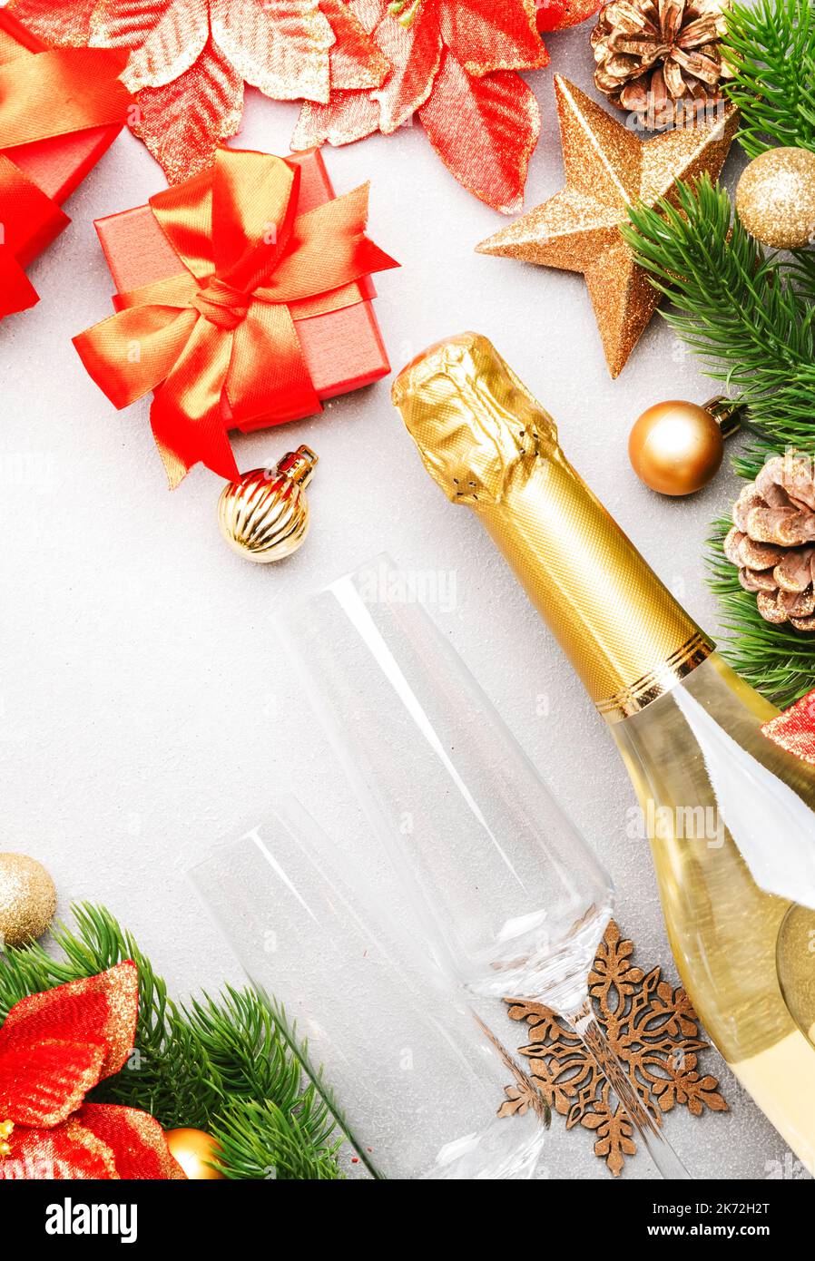 Christmas festive background with champagne bottle and wine glasses ...