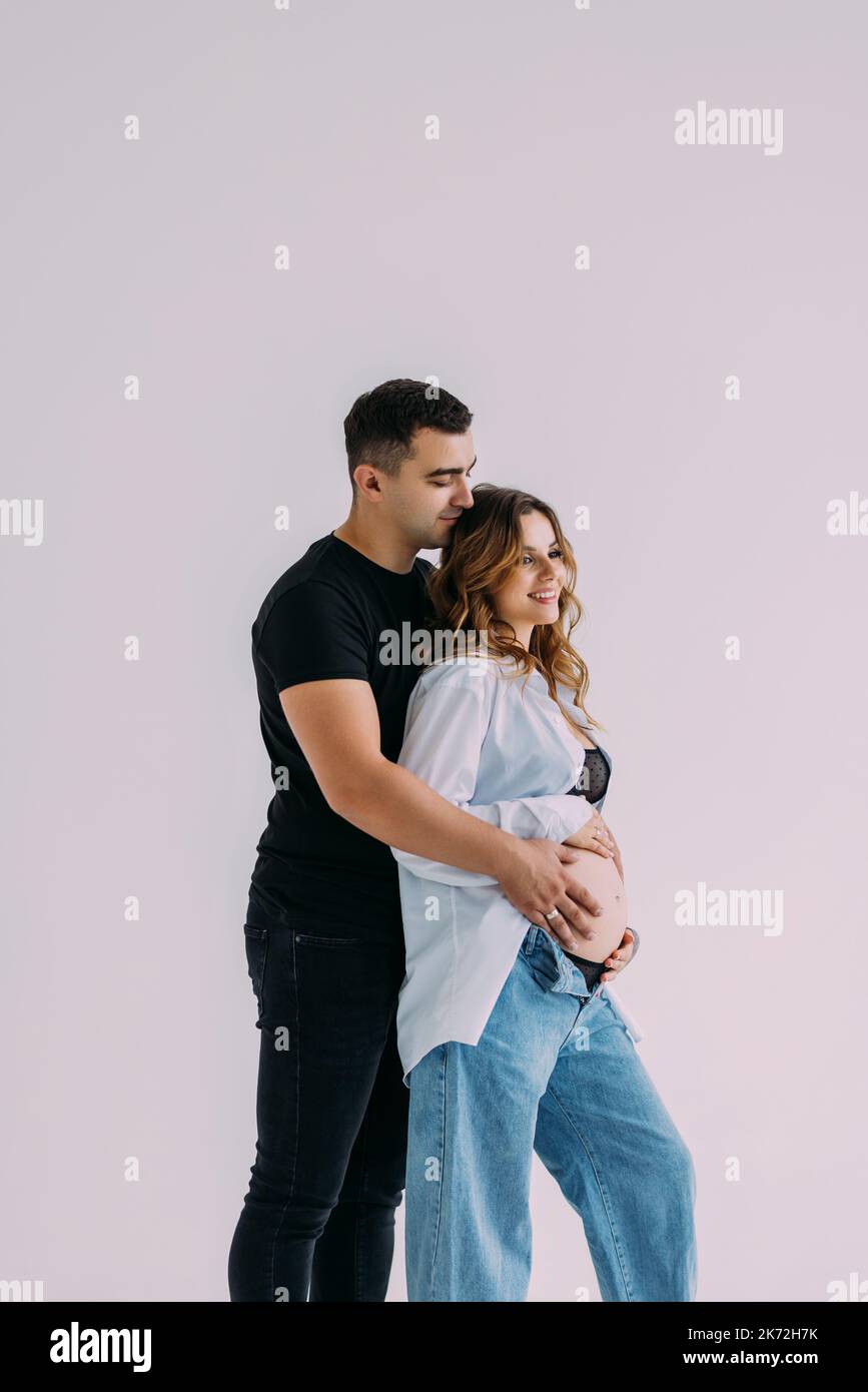 caucasian couple expecting baby smiling cheerful on white Stock Photo ...