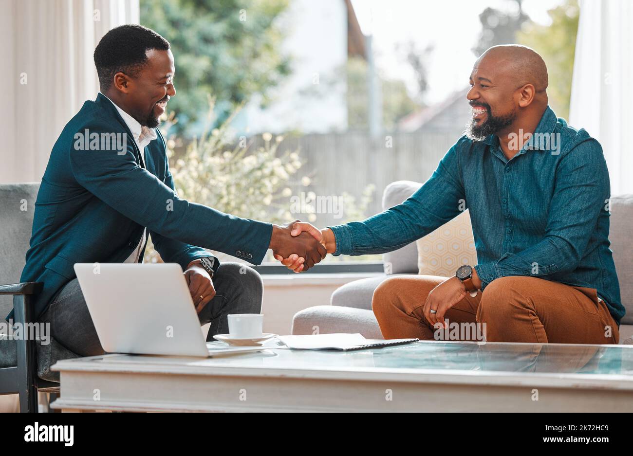 Well make magic together. two businessmen shaking hands in agreement ...