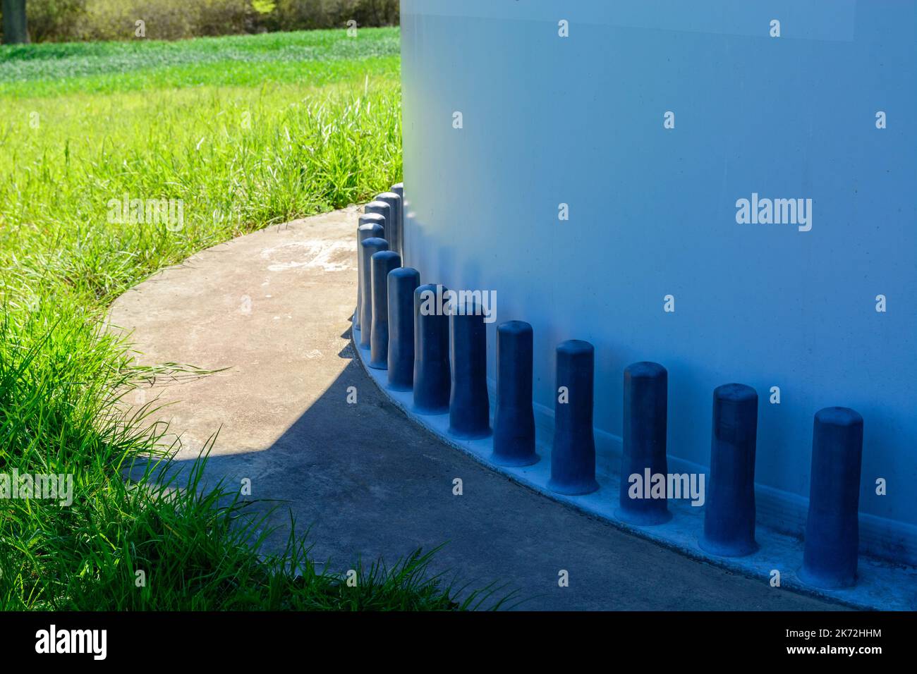 Heavy duty gray bolts around a metal tube Stock Photo - Alamy