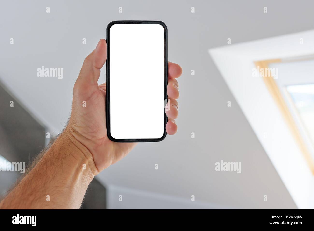 Mockup of of smartphone blank white touchscreen in male hand, man using ...
