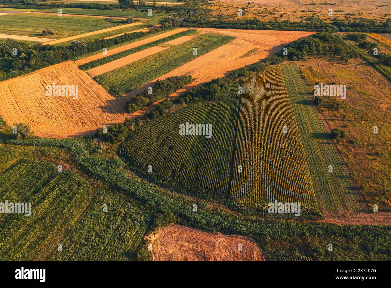 Aerial shot of countryside landscape with cultivated crop fields from ...