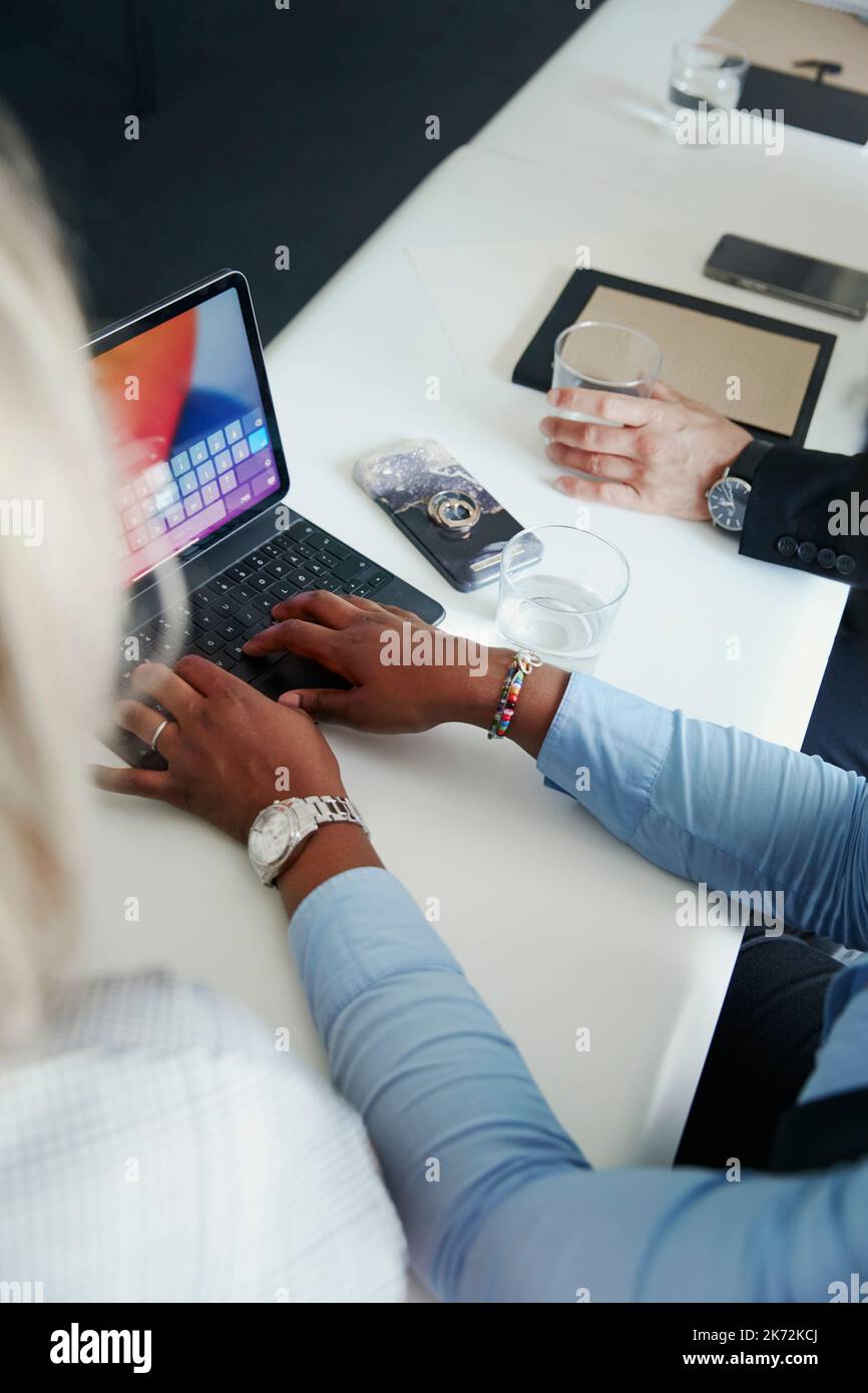 Hands on laptop keyboard Stock Photo - Alamy