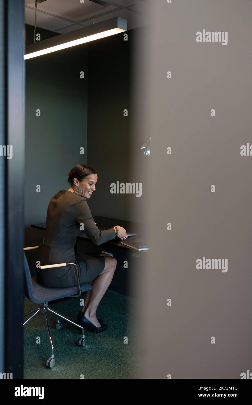 Businesswoman sitting in conference room Stock Photo - Alamy