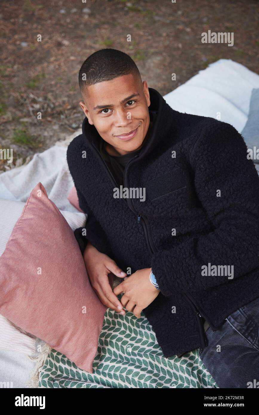 Man relaxing at camping Stock Photo - Alamy