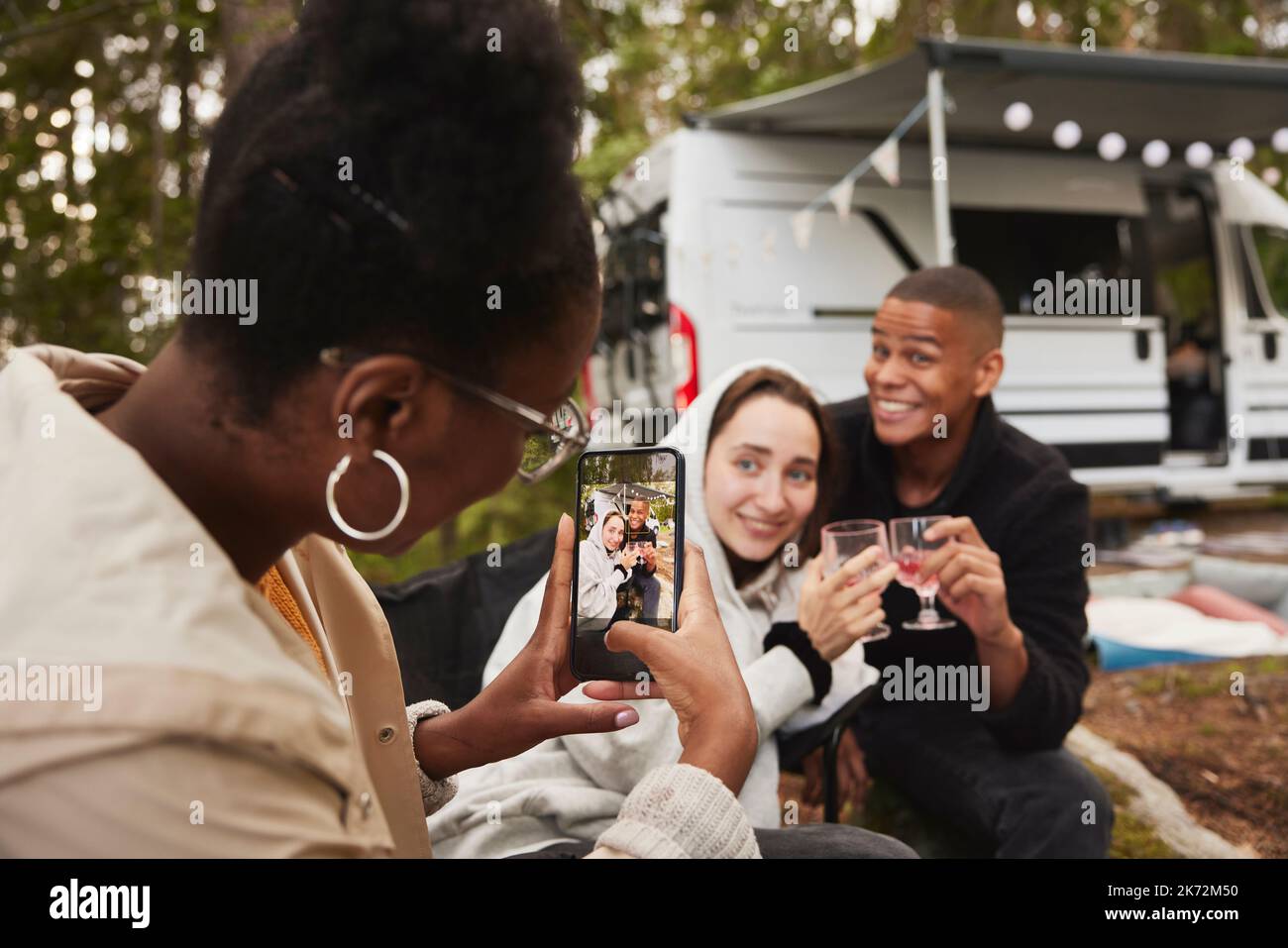 Friends having fun in front of camper van Stock Photo - Alamy