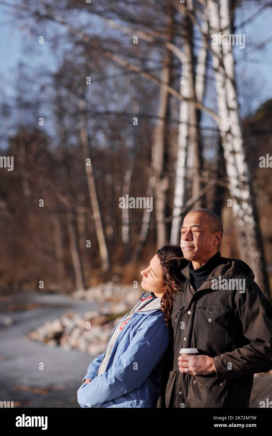 Couple standing together Stock Photo - Alamy