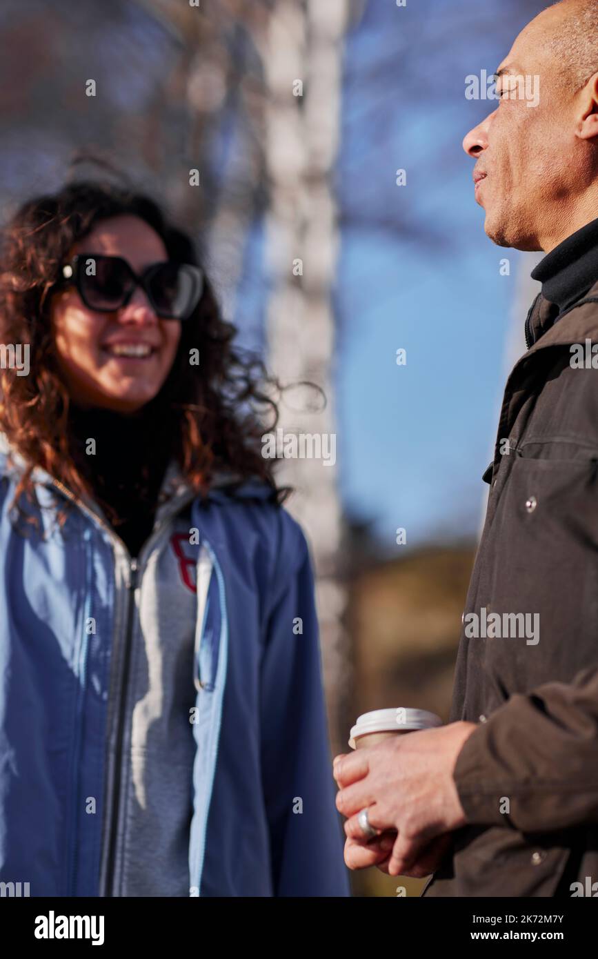 Couple talking together Stock Photo - Alamy