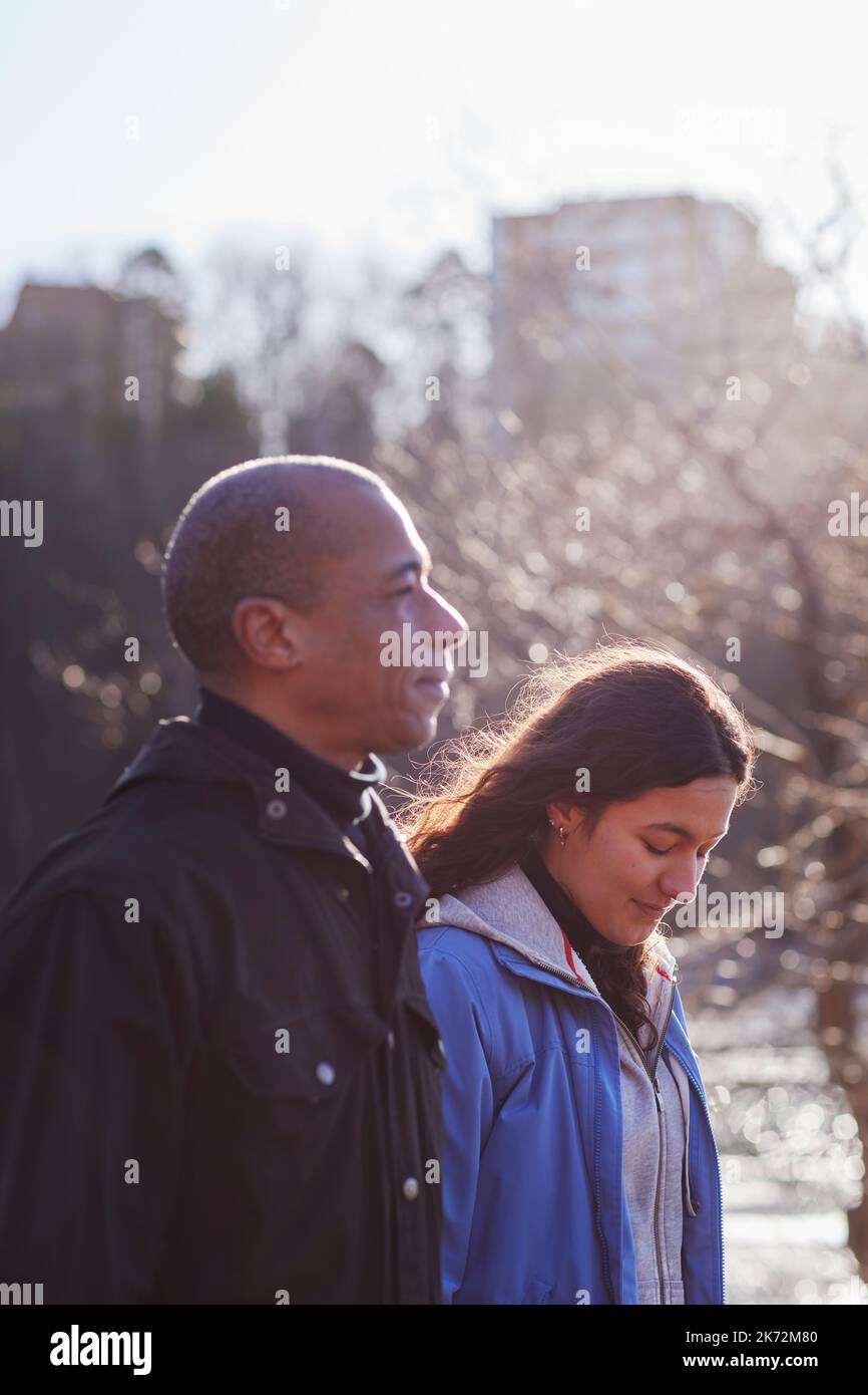 Couple standing together Stock Photo - Alamy