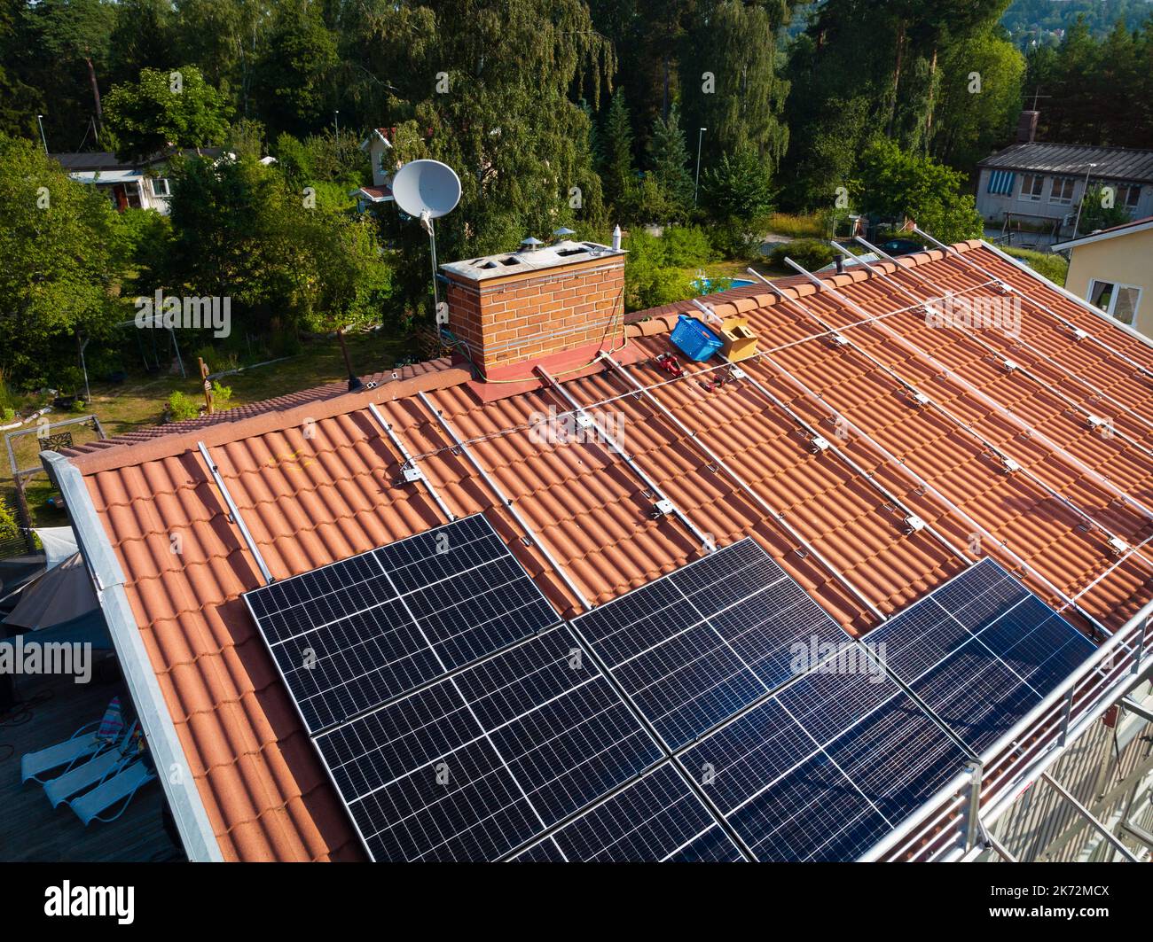 Installation of solar panels on roof of house Stock Photo - Alamy