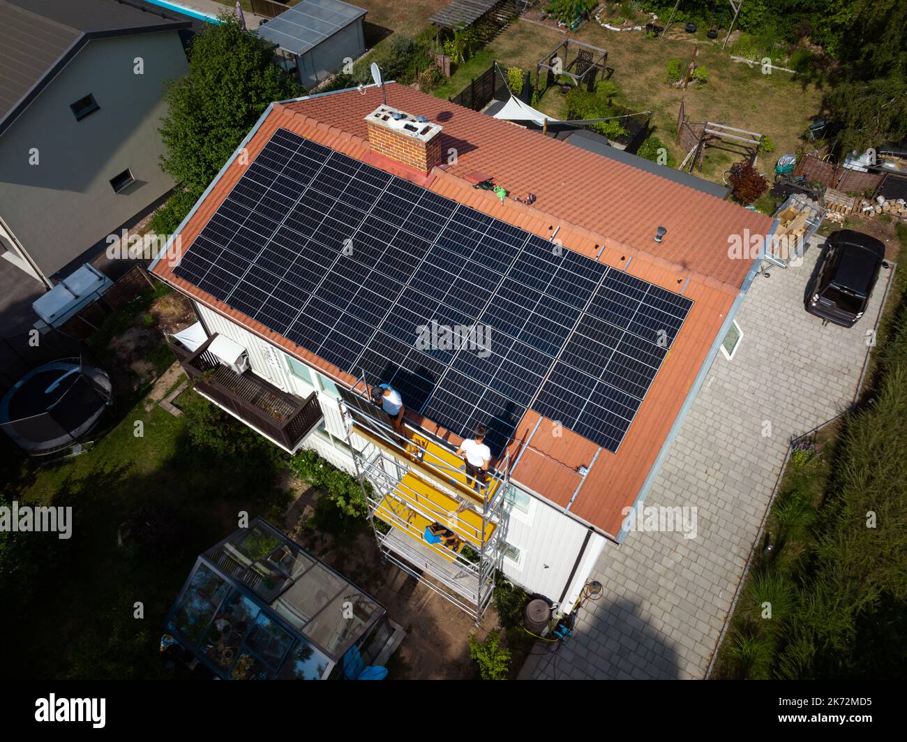 Installation of solar panels on roof of house Stock Photo - Alamy