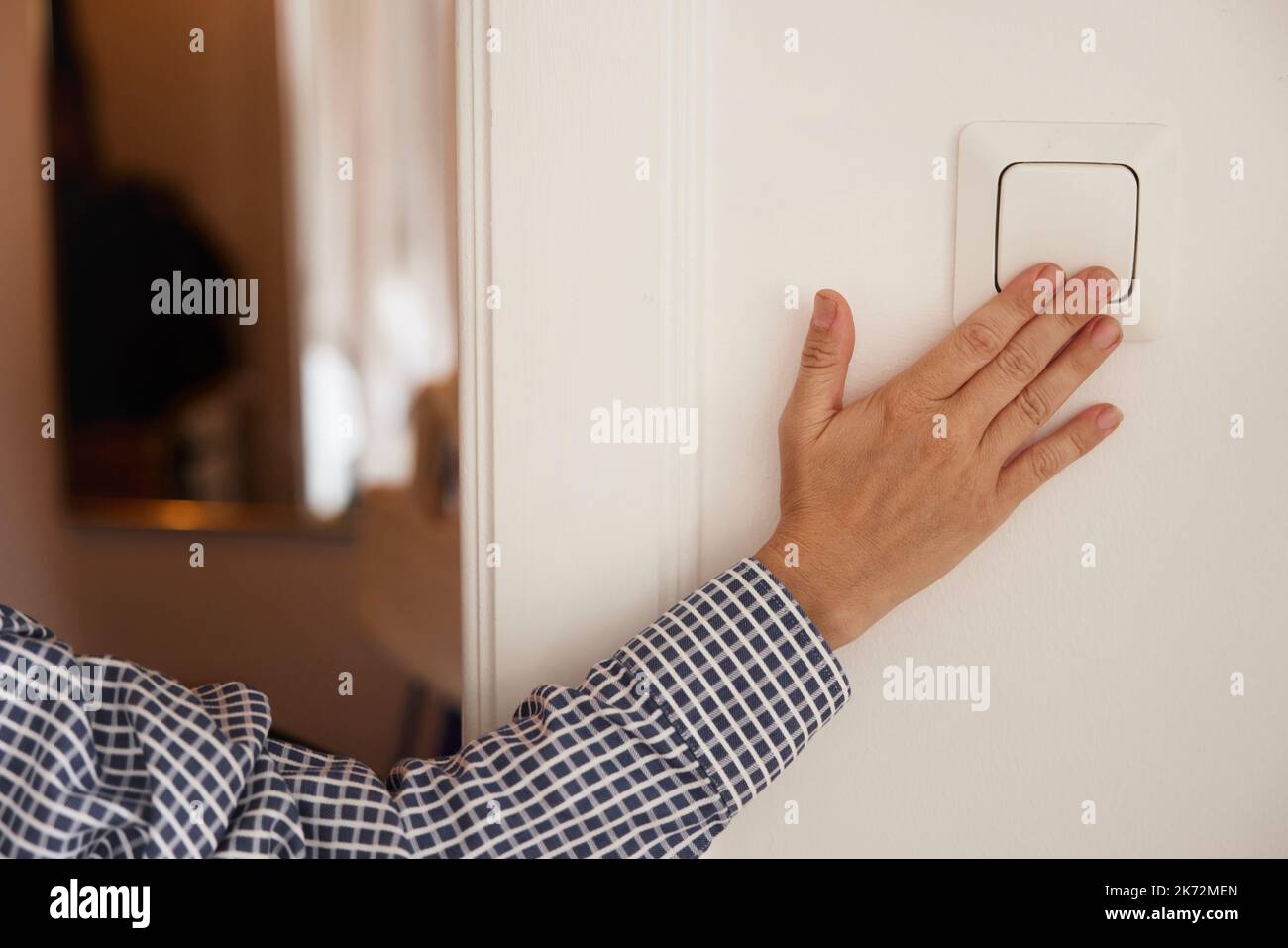 Man turning on light Stock Photo - Alamy