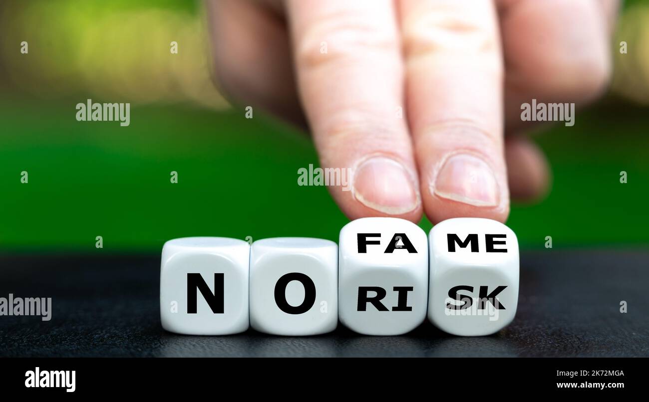 Dice form the expression 'no risk no fame' Stock Photo - Alamy