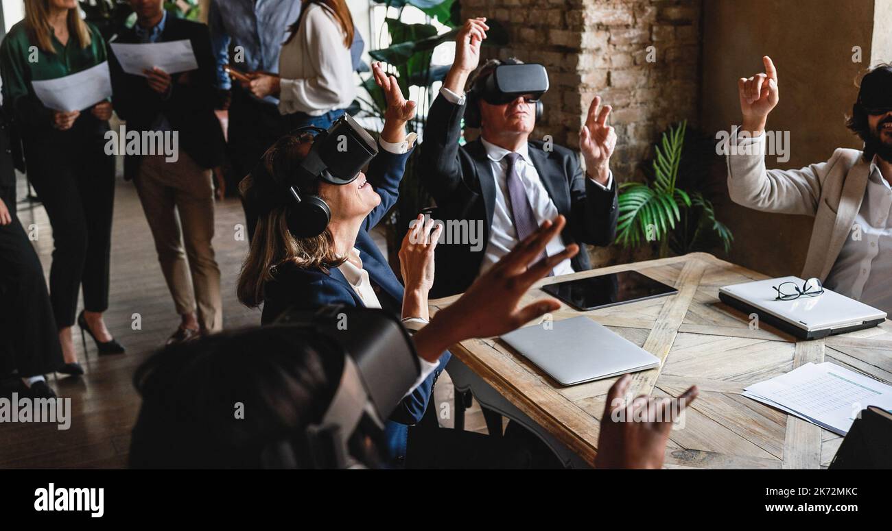 Multiethnic business people wearing vr goggles inside office - Focus on ...
