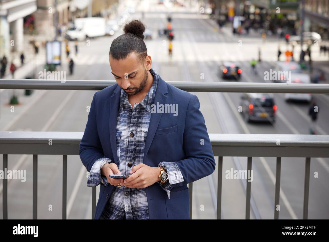 Smiling man using cell phone Stock Photo - Alamy