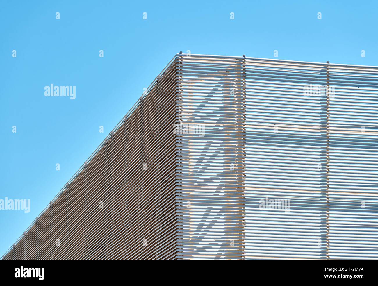 Spaced-mounted aluminum profiles covering the exterior of a building ...
