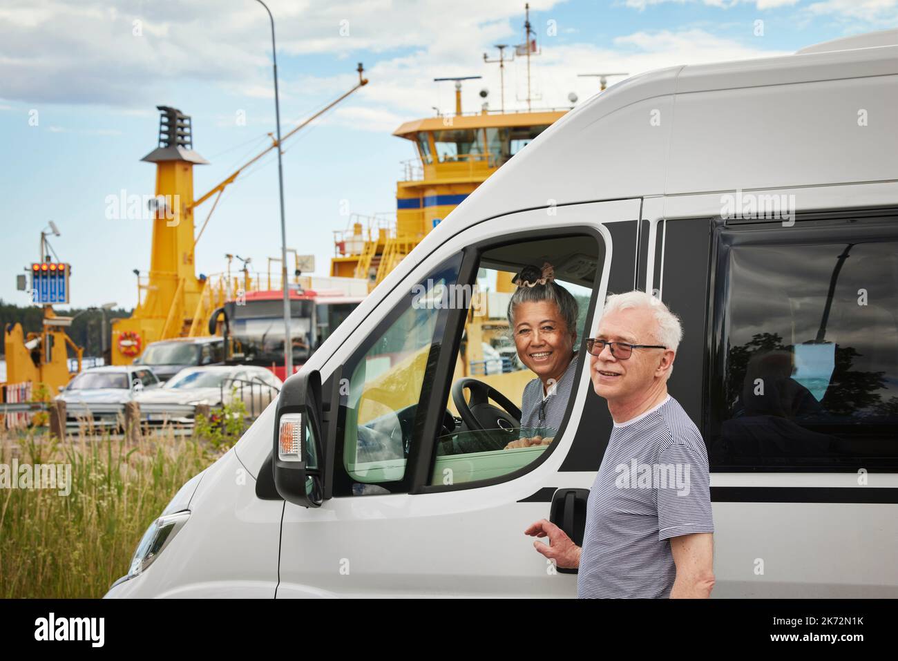 Senior couple getting in van Stock Photo - Alamy