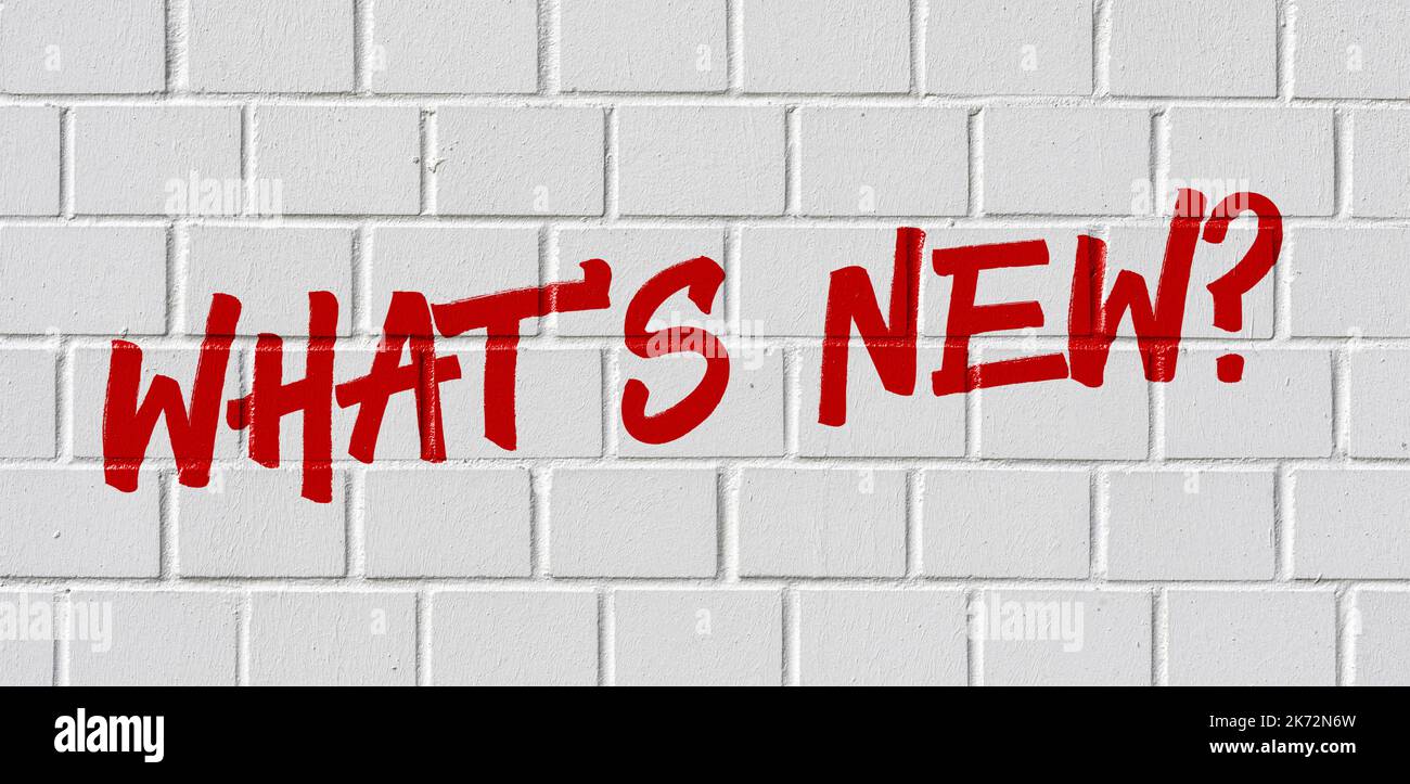 Graffiti on a brick wall - What's new Stock Photo - Alamy
