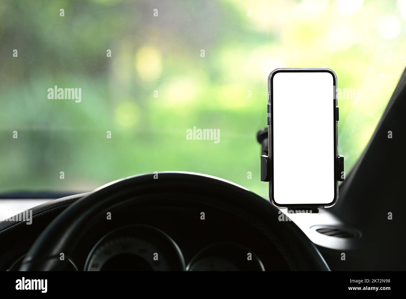 Mobile phone on universal mount holder in car for GPS. Blank screen for ...