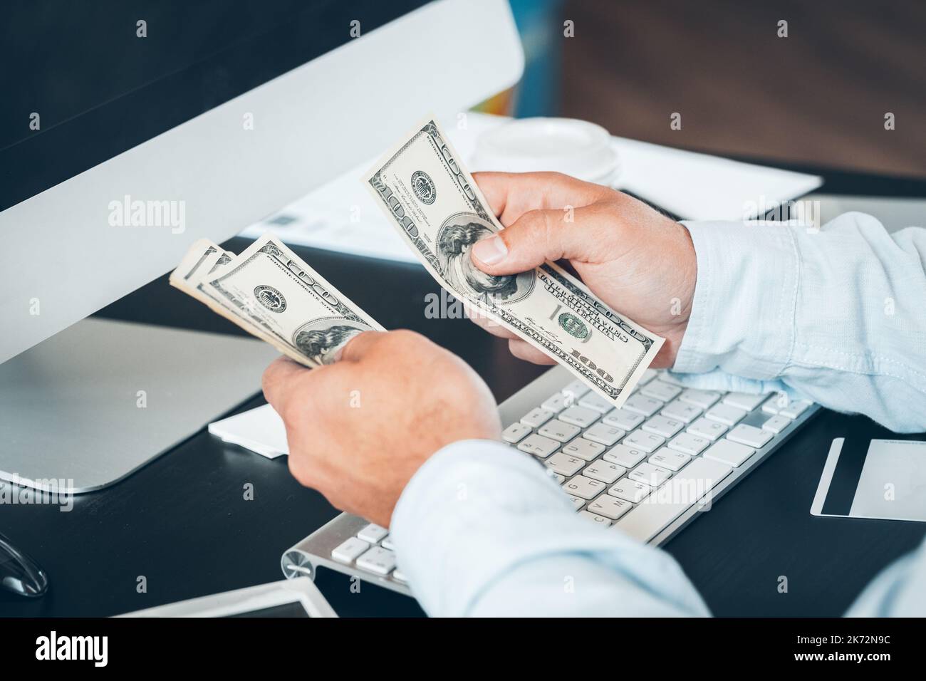 Caucasian hands counting dollar banknotes Stock Photo - Alamy