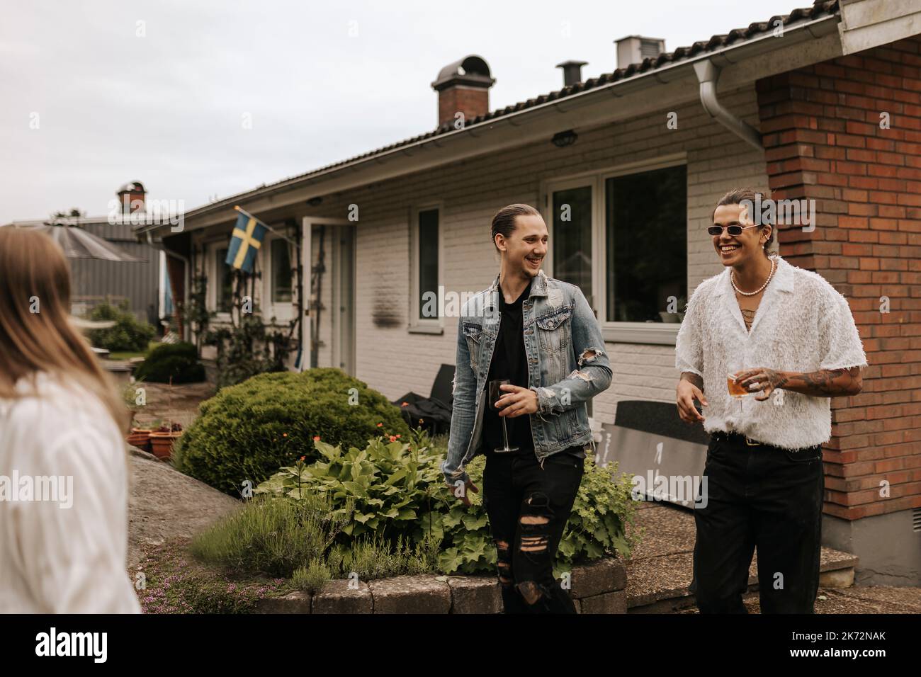 Friends walking together Stock Photo - Alamy